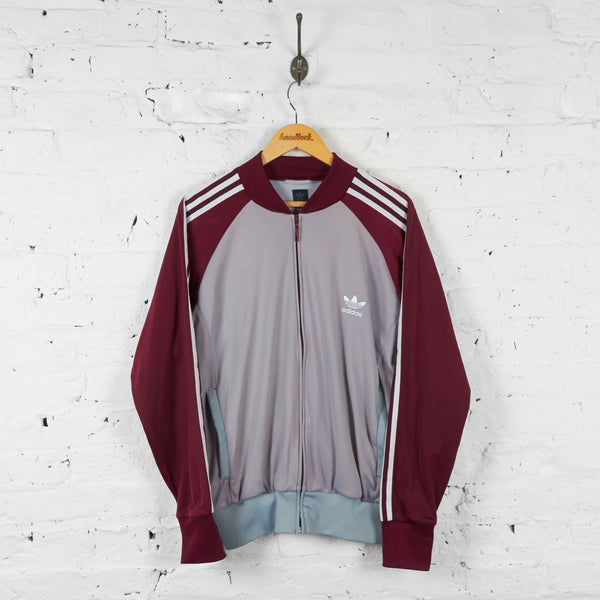 maroon track top